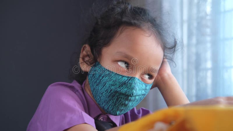 A Upset Child Girl with Face Mask Looking Down Stock Footage - Video of ...