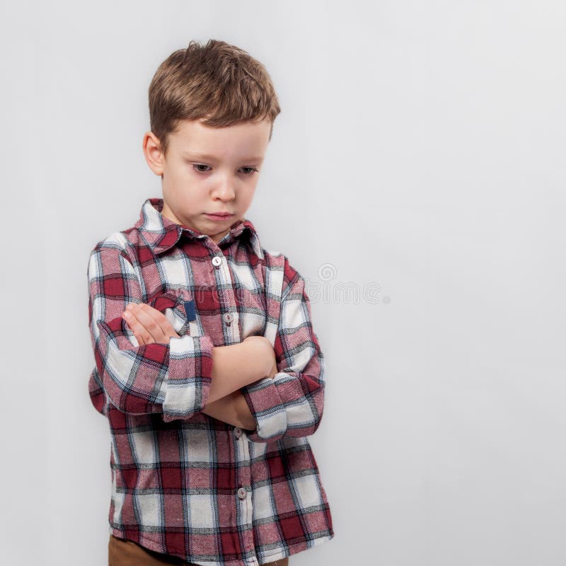 An Upset Child with a Sad Expression: Reflecting Emotions and ...