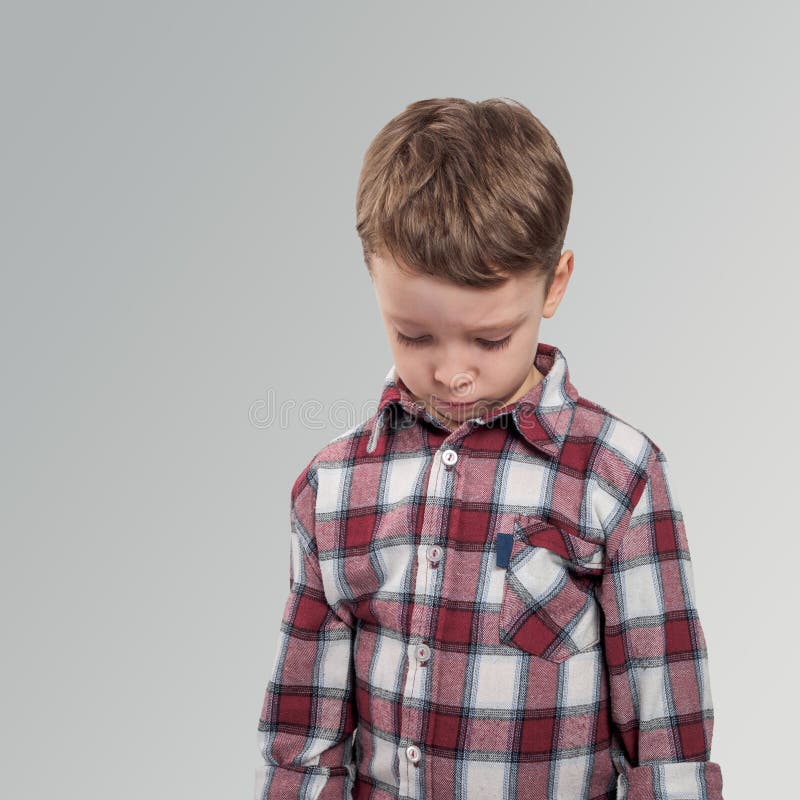 An Upset Child with a Sad Expression: Reflecting Emotions and ...