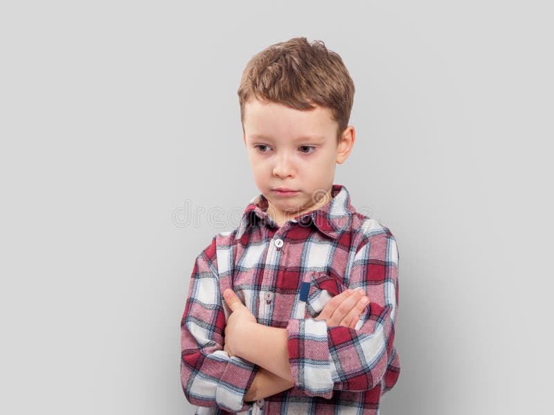 An Upset Child with a Sad Expression: Reflecting Emotions and ...