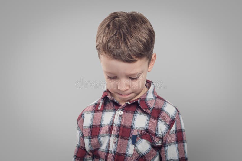 An Upset Child with a Sad Expression: Reflecting Emotions and ...