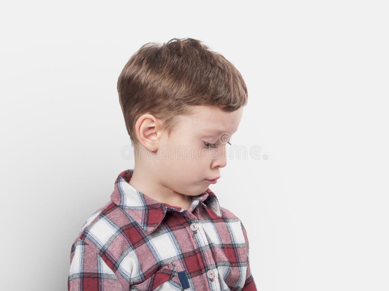 An Upset Child with a Sad Expression: Reflecting Emotions and ...