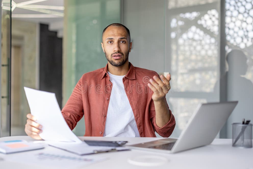 Upset and Confused Man Looking at Camera while Working Inside Office ...