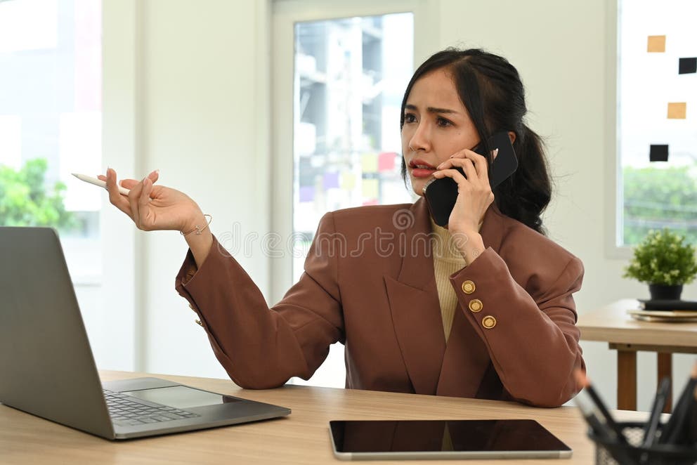 Upset Female Business Advisor Having Phone Conversation with Client and ...