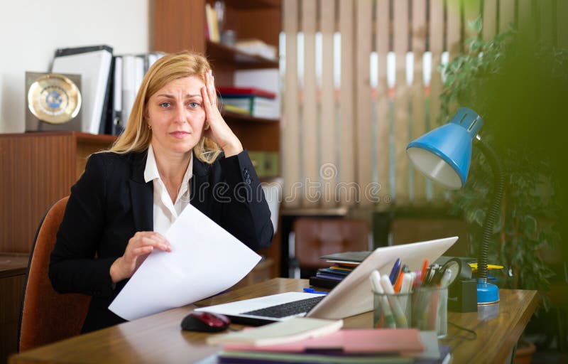 Upset Girl Secretary in the Office Sitting at the Workplace at Computer ...