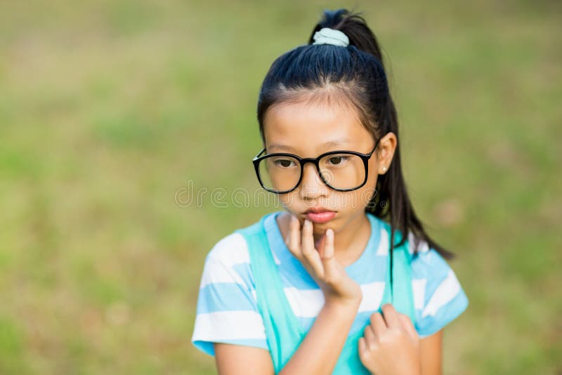 Upset girl sitting in park stock photo. Image of multiethnic - 77906510
