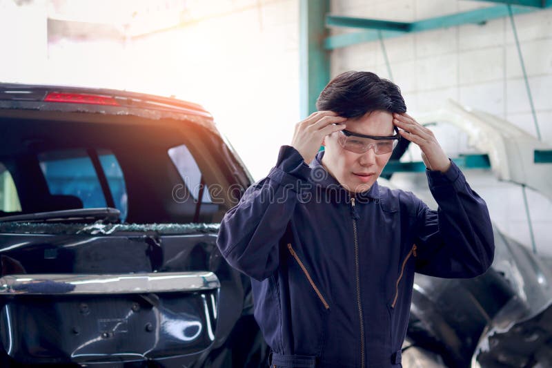 Upset Man Auto Mechanic Puts Hands on Head, Thinking about Problems ...