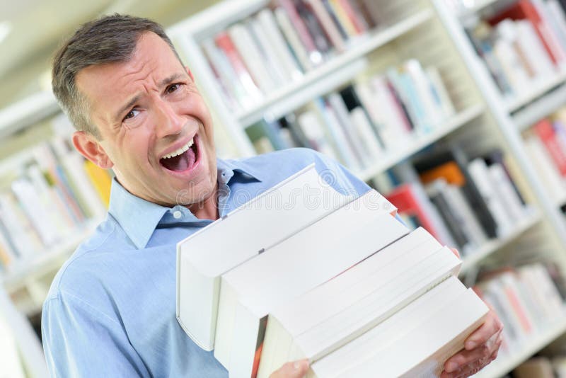 Upset man with books stock image. Image of improved - 262700951