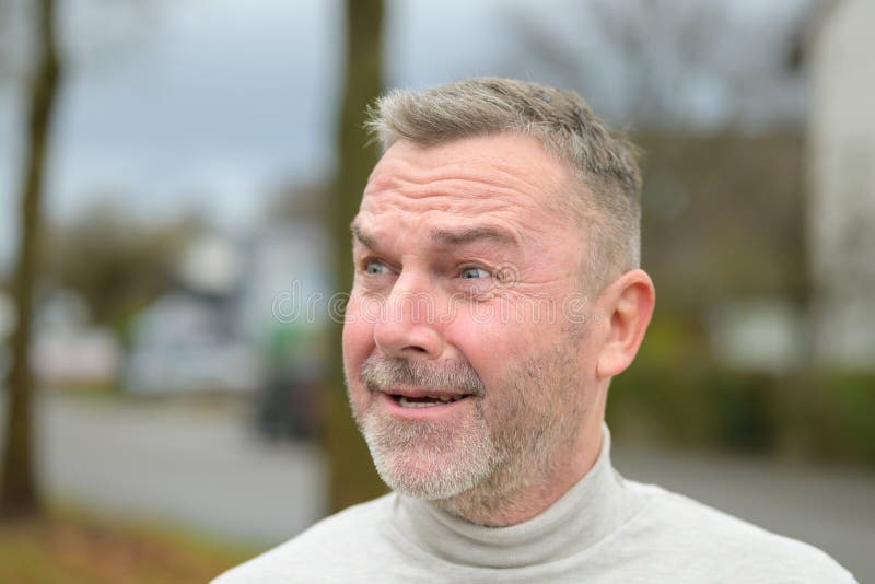 Upset Man Looking Aside with an Anguished Expression Stock Photo ...