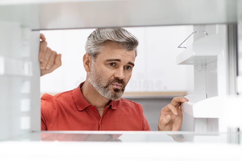 Upset Middle Aged Man Looking Inside Empty Fridge Stock Image - Image ...
