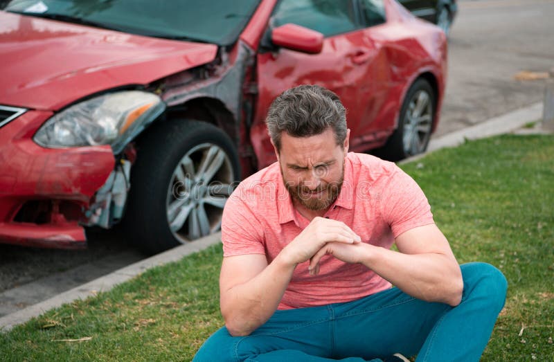 Upset Sad Driver Sitting on the Road Next To Broken Car. Stock Photo ...