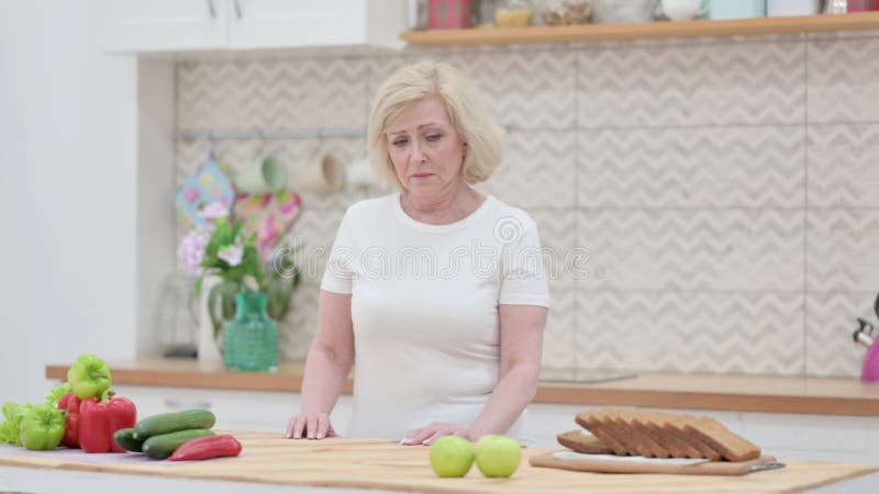 Upset Old Woman Standing in Kictchen Stock Image - Image of modern ...