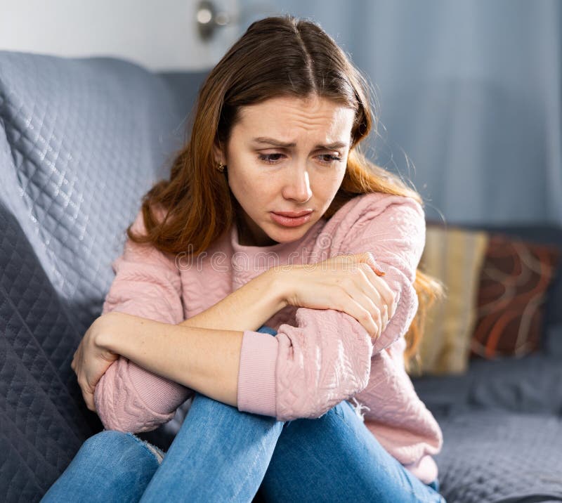 Upset Woman Crying While Sitting On A Sofa In Room Stock Image Image Of Ailment Inside 298099465