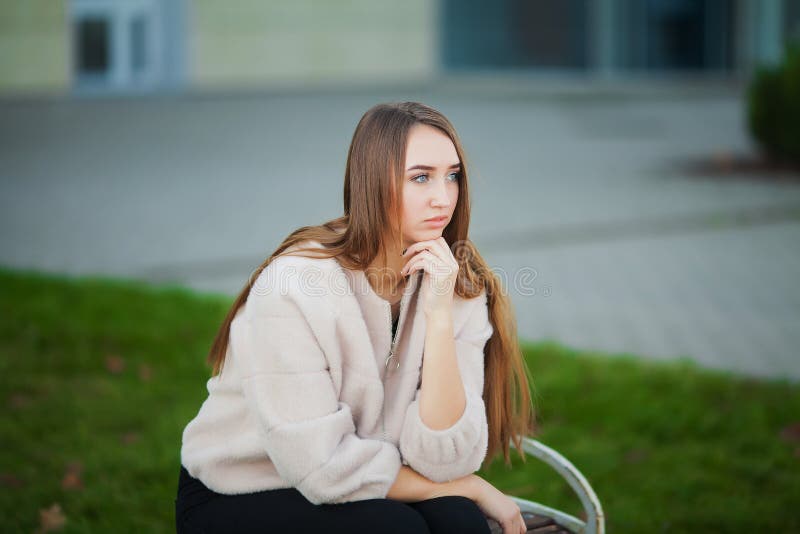Upset Woman with Problems Sitting on a Bench. Stock Photo - Image of ...