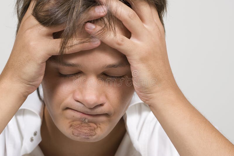 Upset young man stock image. Image of head, adult, hands - 15947413
