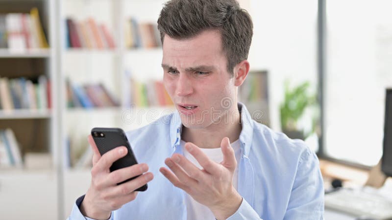 Upset Young Man Get Shocked on Smartphone Stock Photo - Image of ...