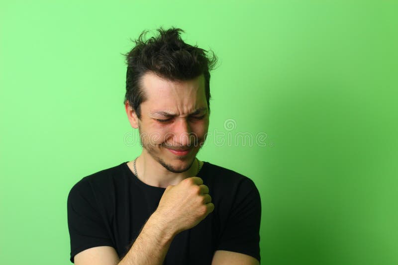 Upset Young Man On A Light Green Wall Background. Emotion Of Chagrin ...