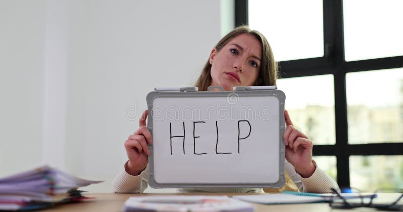 Upset Young Woman Holding Sign with Help Text in Office Stock Footage ...