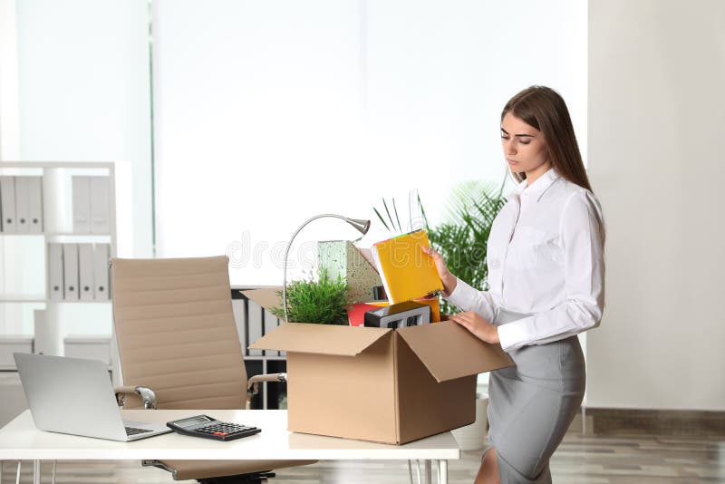 Upset Young Woman Packing Stuff in Box Stock Photo - Image of light ...