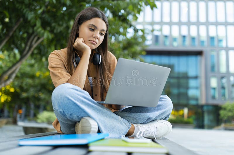Upset Young Woman University Student Sitting at Park, Using Notebook ...