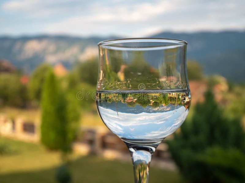 Upside Down Nature View from a Transparent Glass Half Full of Water ...