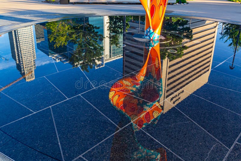 Upside Down Reflections of Skyscrapers in the Pool at Base of the Wind ...