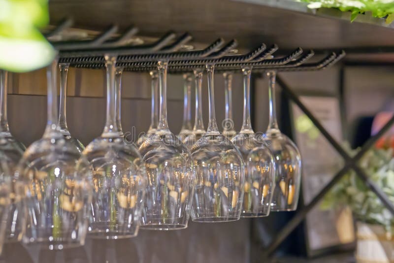 Upside-Down Wine Glasses Hanging in Bar Stock Image - Image of luxury ...