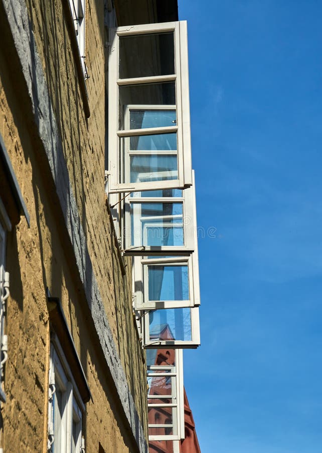 Upward View Along a House Wall with Open Windows with White Painted ...