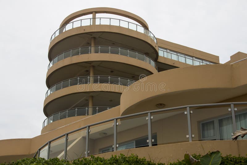 Upward View of Circular Residential Building Against Cloudy Sky Stock ...