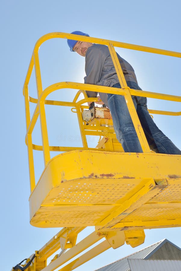 Upward View Man in Cherry Picker Bucket Stock Image - Image of ...