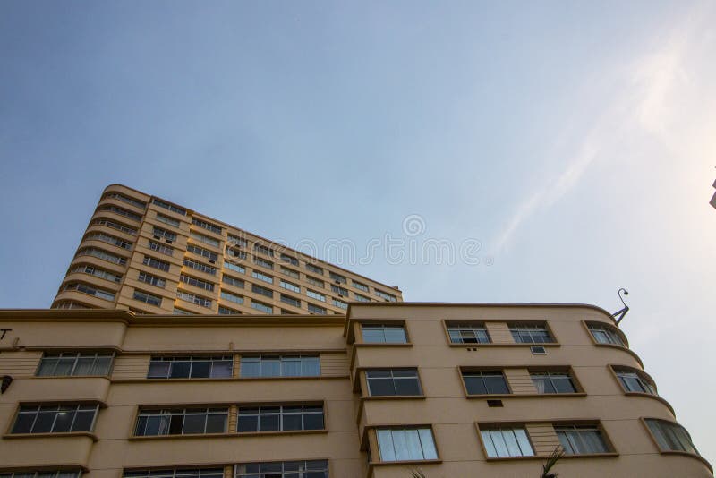 Upward View of Residential Building Against Blue Sky Stock Image ...