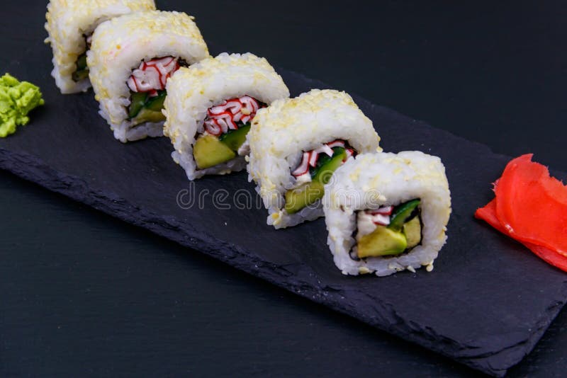 Uramaki Sushi Rolls with Surimi on Black Slate Stock Image - Image of ...