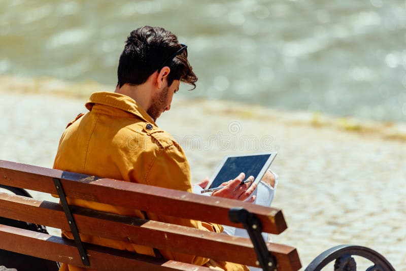 Urban Businessman Looking at His Tablet Stock Image - Image of elegant ...