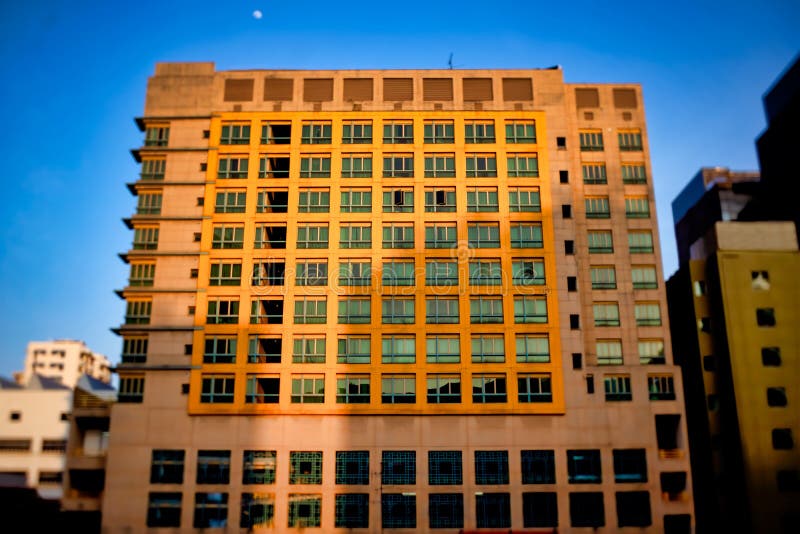 Urban Orange Cityscape Buildings Against Blue Sky Stock Image - Image ...
