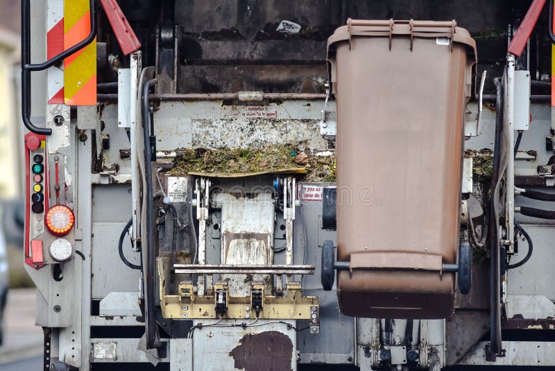 Urban Cleaner Emptying Trash Cans into a Dump Truck Close-up Stock ...