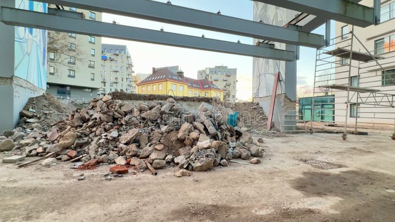Urban Construction Site Featuring a Debris Pile Surrounded by Building ...