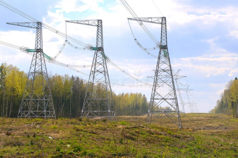 Urban Electricity Supply. High-voltage Power Lines and a Blue Sky with ...