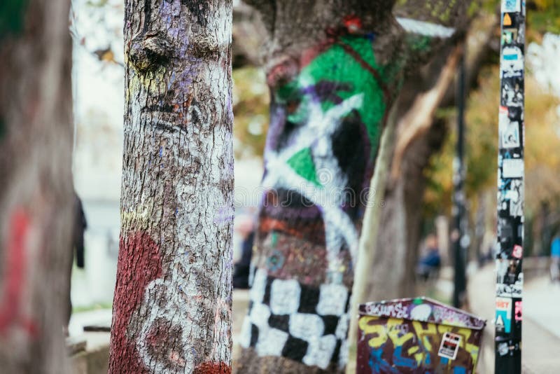 Urban Graffiti on Trees and Walls Stock Photo - Image of destruction ...