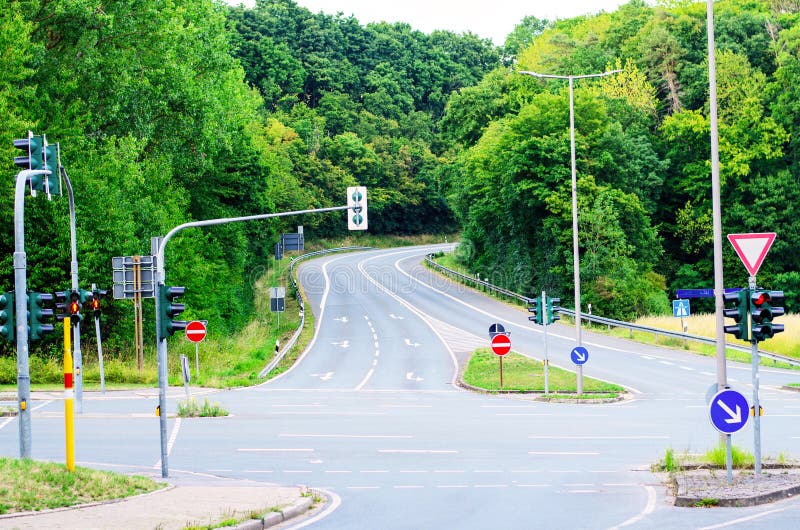 Urban Intersection with Two Traffic Lights Signs and Green Tree Leaves ...