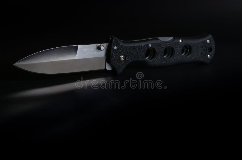 Urban Knife. Black Knife on Black Background Stock Image - Image of ...