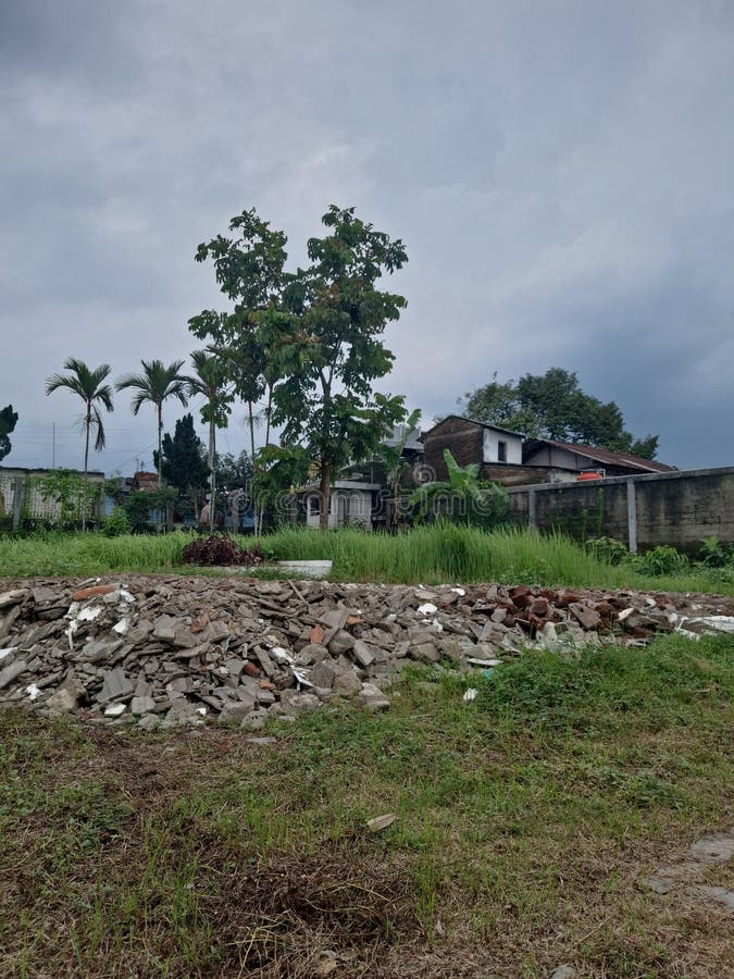 Urban Landscape with Rubble, Sky and Greenery Stock Image - Image of ...