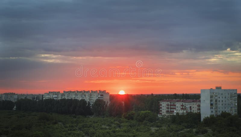 Urban Landscape at Sunset with a Beautiful Orange Sun Stock Image ...