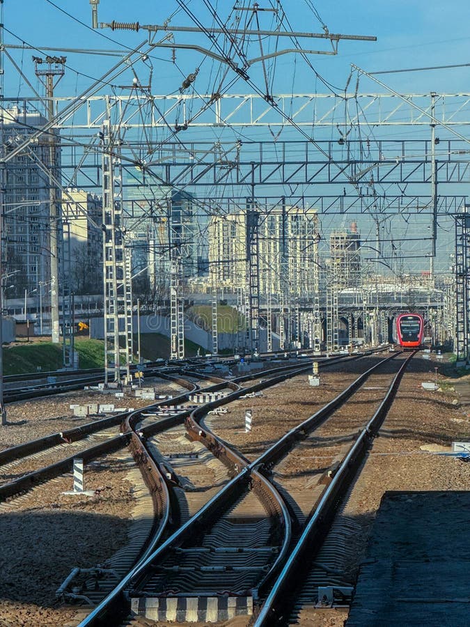 Urban Railway with Multiple Tracks and Approaching Red Train Stock ...