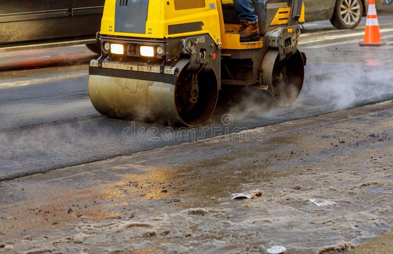 Urban Road is Under Construction, Asphalting of Yellow Roller Stock ...