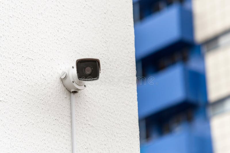 Urban Security Camera on Wall with City Building Stock Photo - Image of ...