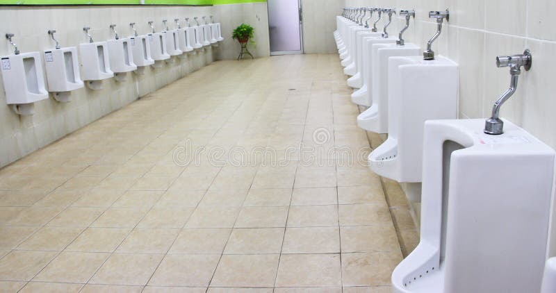 Male Urinals with Poster of Ladies Looking Editorial Stock Image ...