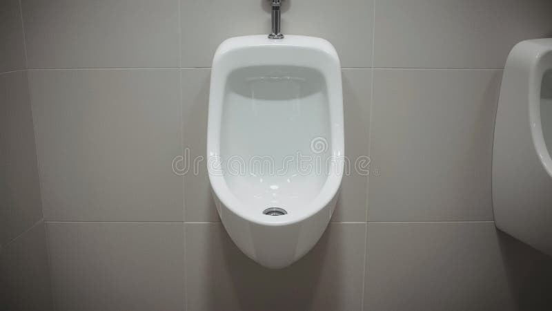 Urinal in Clean and Modern Public Restroom for Men, WC Stock ...