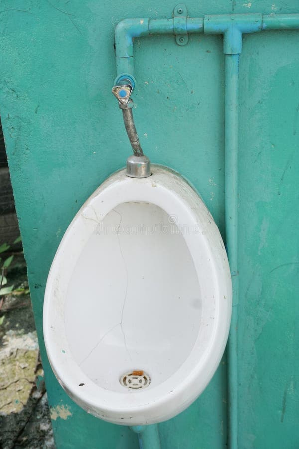 Urinal on green wall stock image. Image of public, close - 144717501