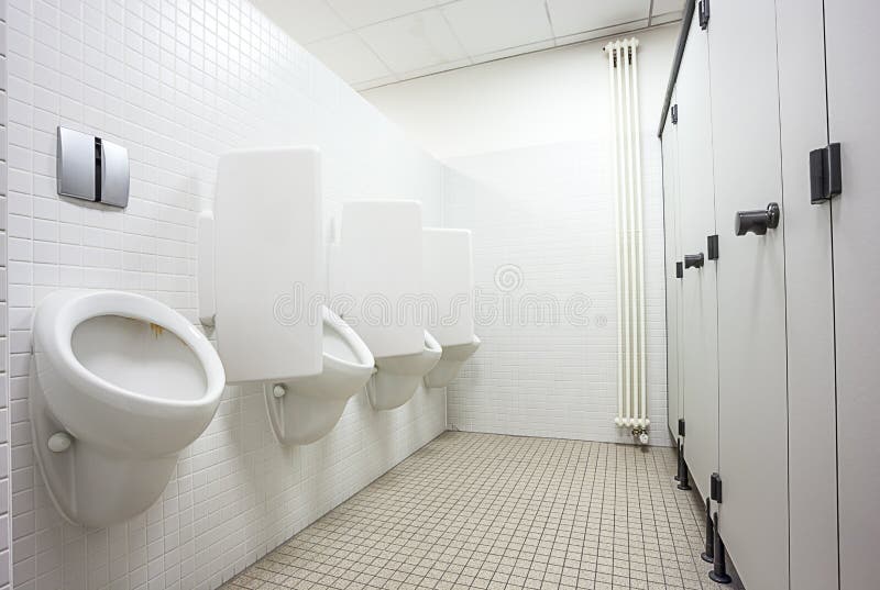 Urinal and toilet doors stock photo. Image of view, interior - 67744752