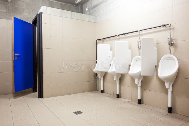 Urinal and toilet doors stock image. Image of clean, sanitary - 95772729
